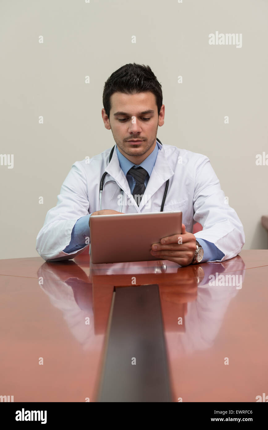 Handsome Doctor Looking At His Computer Monitor In His Office Stock ...