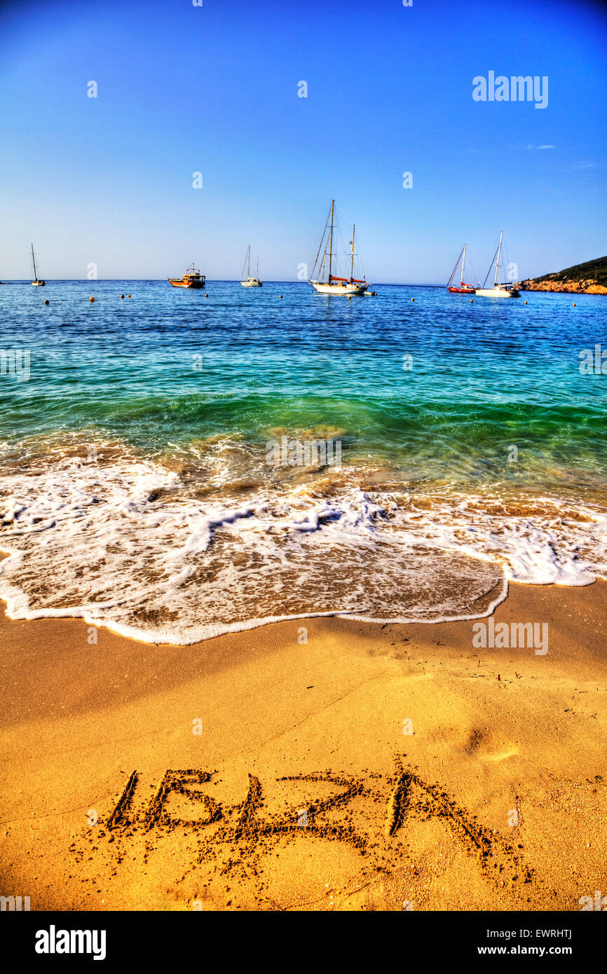 Ibiza word in sand written on beach resort sea coast coastline holiday ...