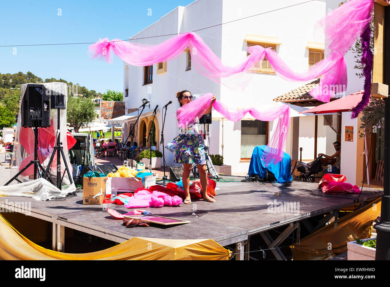 Setting up stage for concert woman bunting Ibiza Spain Spanish resort ...