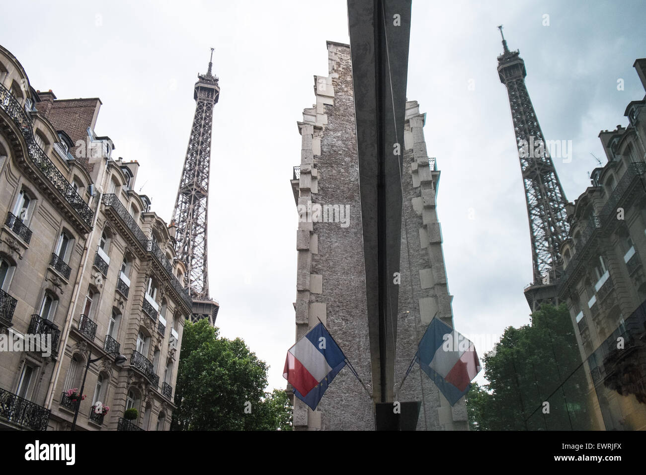Reflection of glass wall at Museum Quai Branly with two mirror Eiffel ...