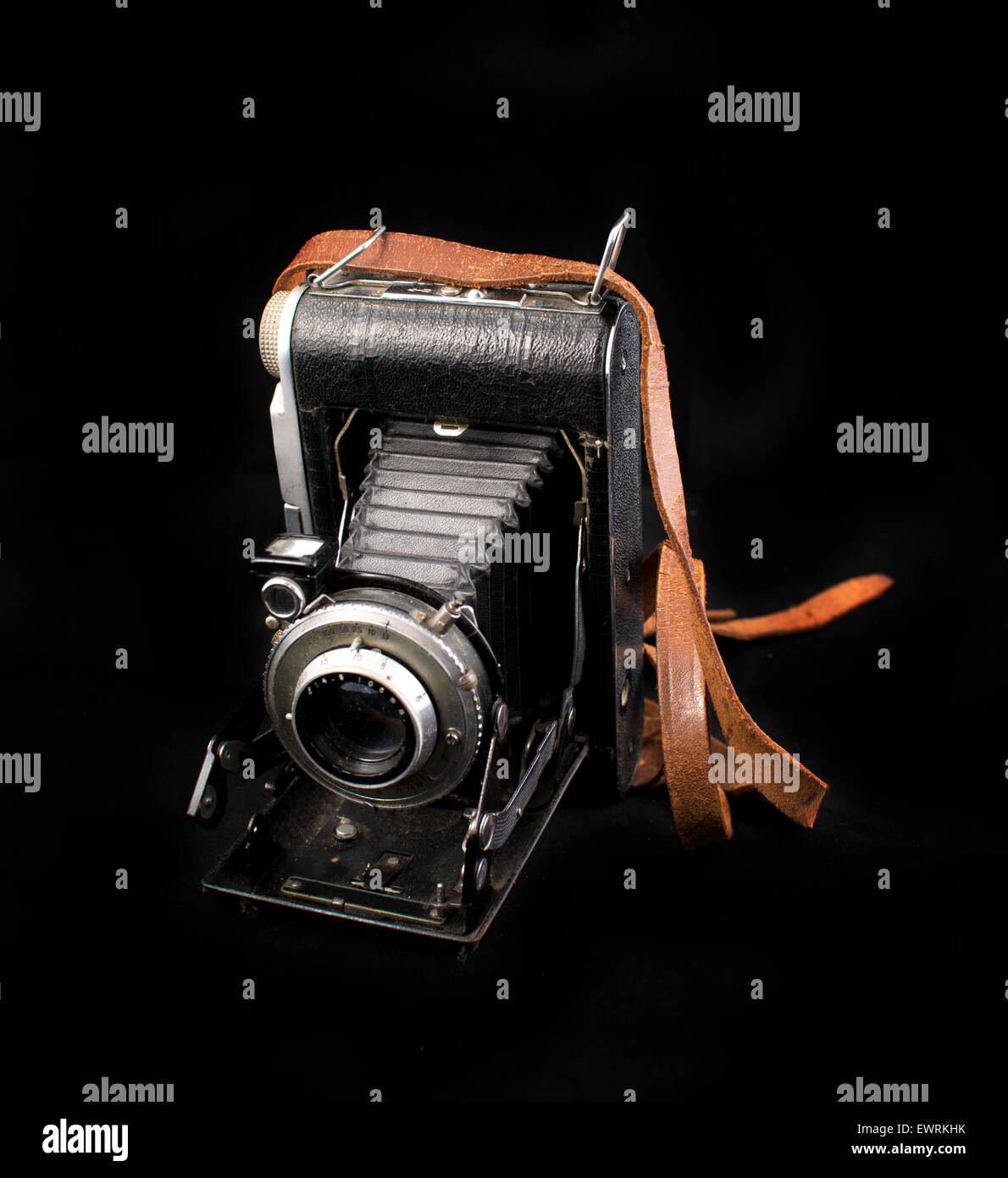 Vintage analog photo camera with bellows isolated on black background ...