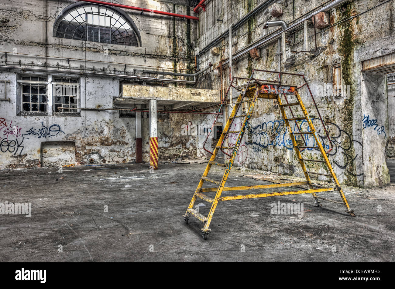 Abandoned yellow stepladder in a dilapidated factory Stock Photo - Alamy