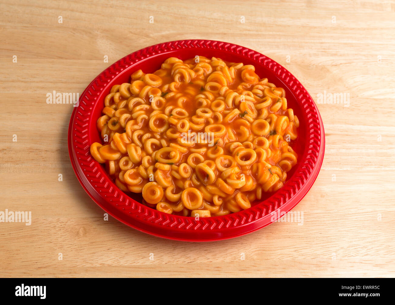 Side angle view of cooked canned round spaghetti pasta in tomato sauce ...