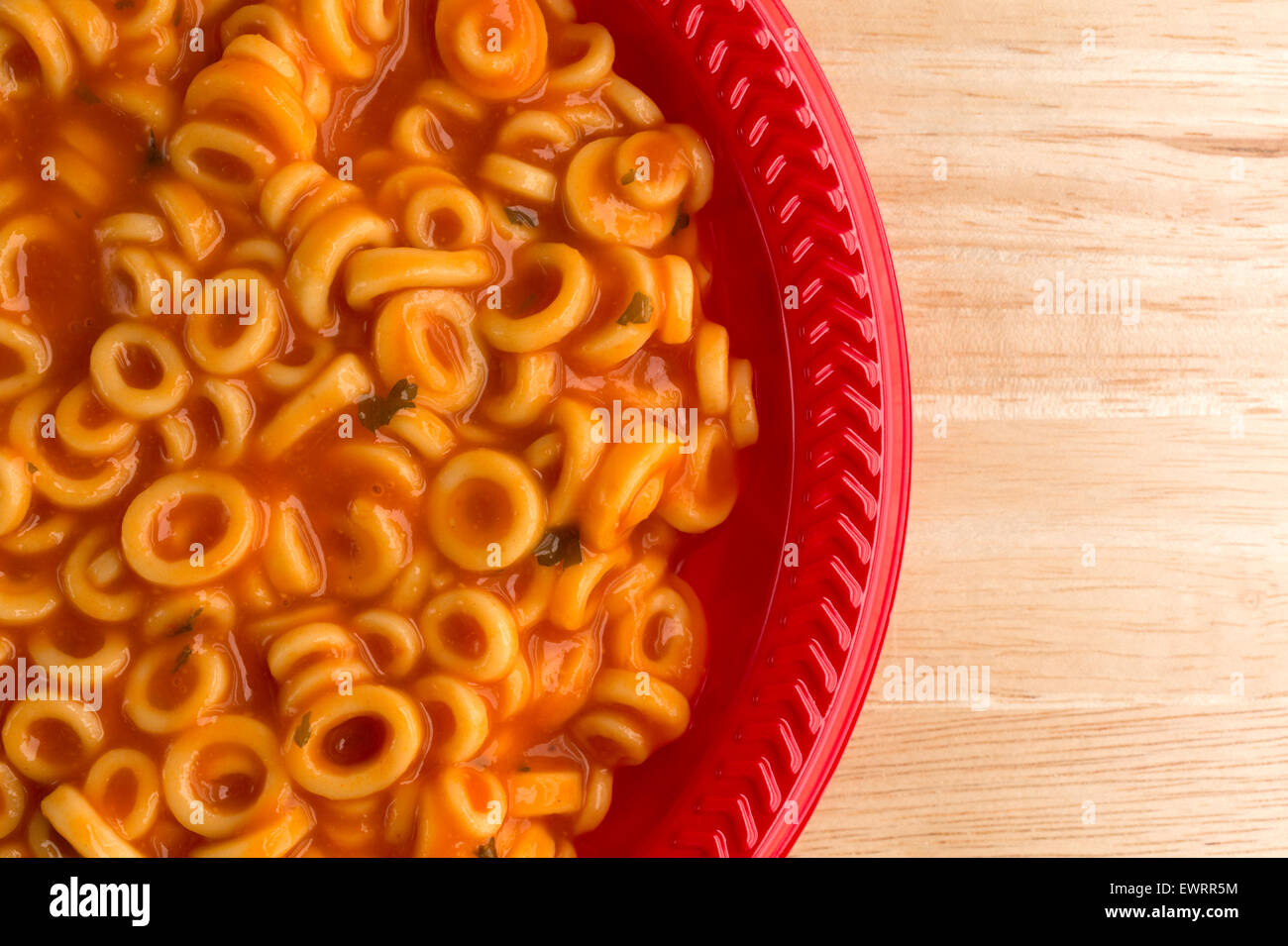 A close top view of canned round spaghetti pasta in tomato sauce on a ...