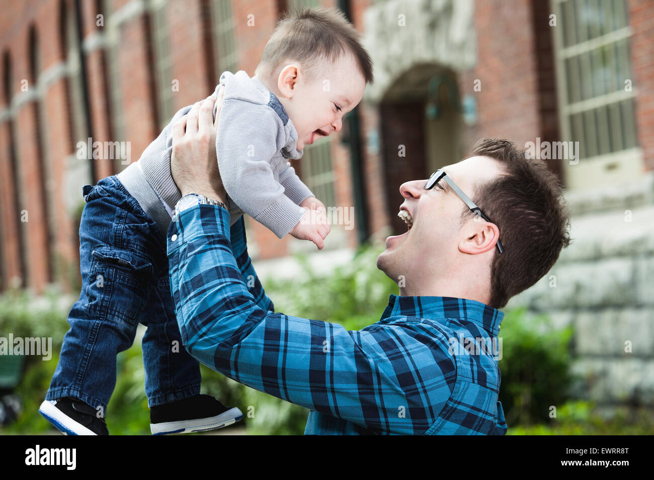 Little baby and father having fun outdoors Stock Photo - Alamy