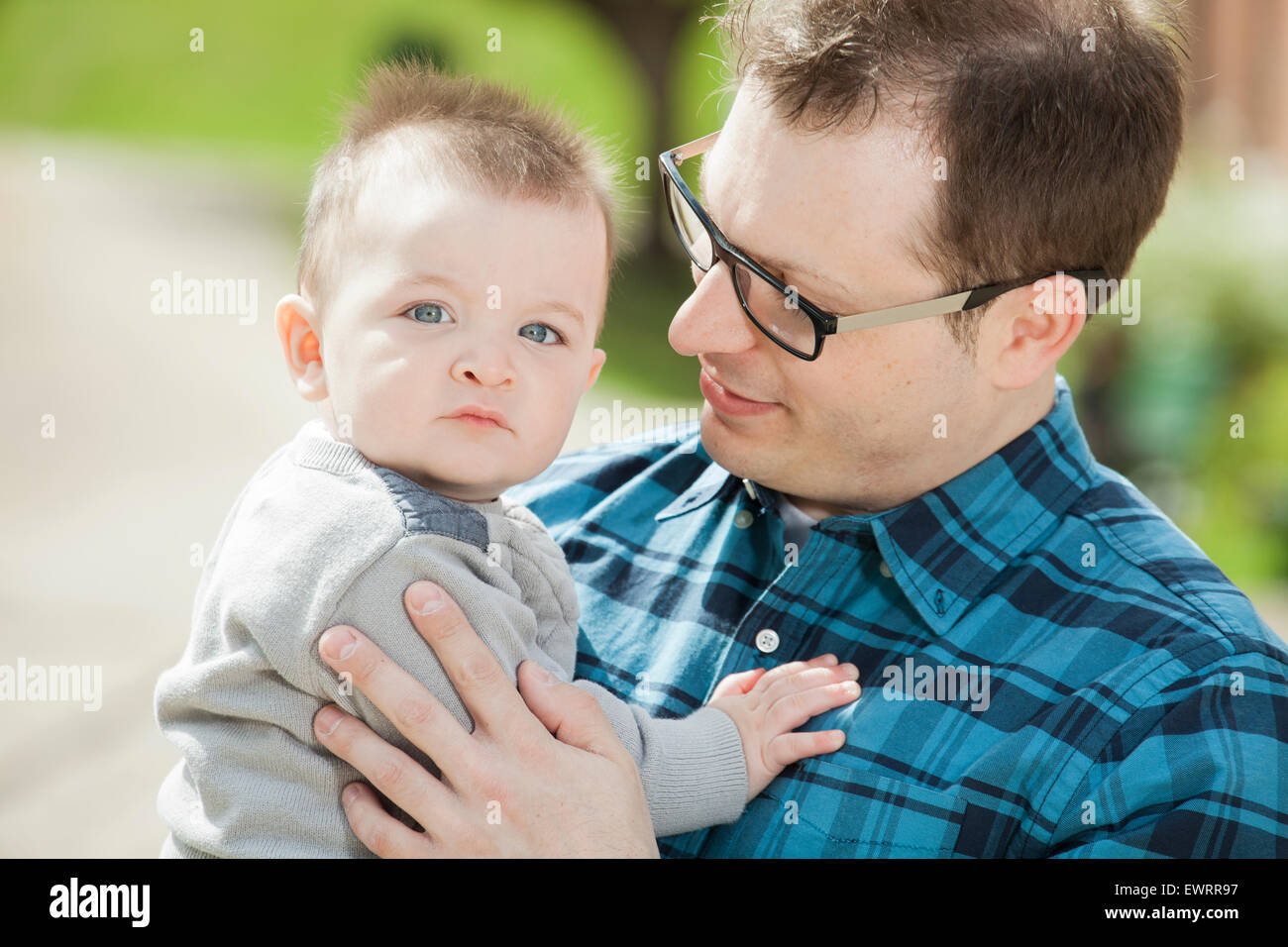 Little baby and father having fun outdoors Stock Photo - Alamy
