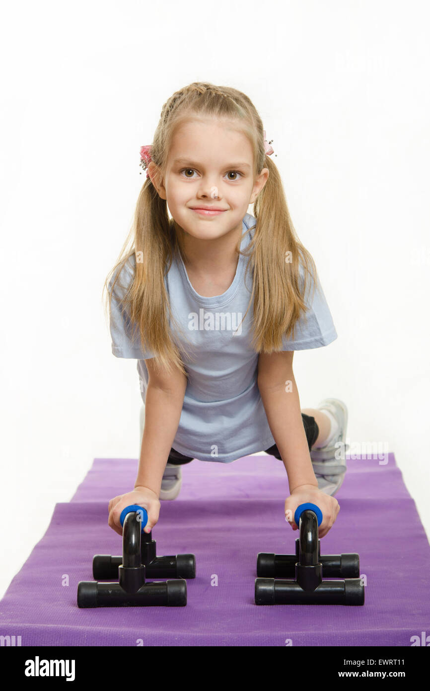 Six year old girl Europeans engaged in physical exercises Stock Photo ...