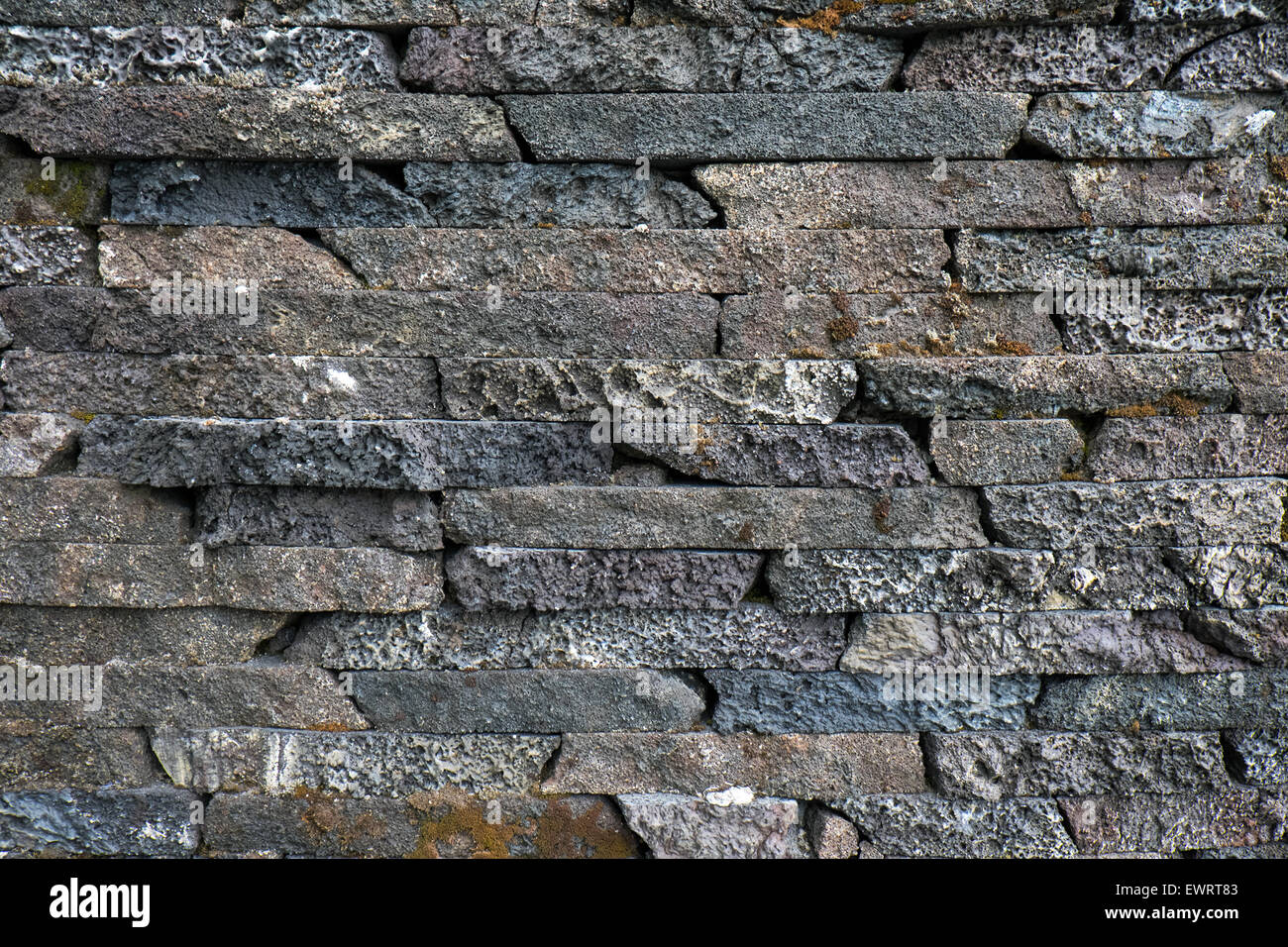 Background from a black wall constructed with volcanic material Stock ...