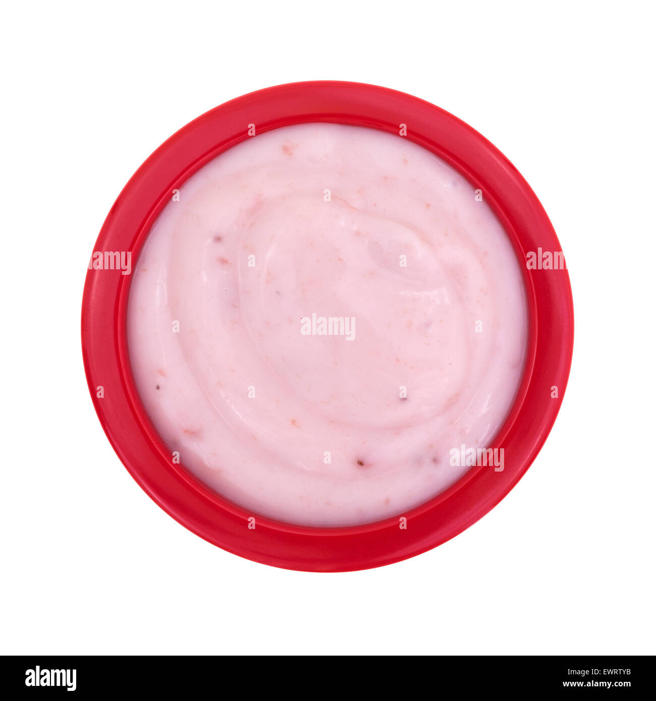 Top view of a small serving of creamy strawberry yogurt in a red bowl ...