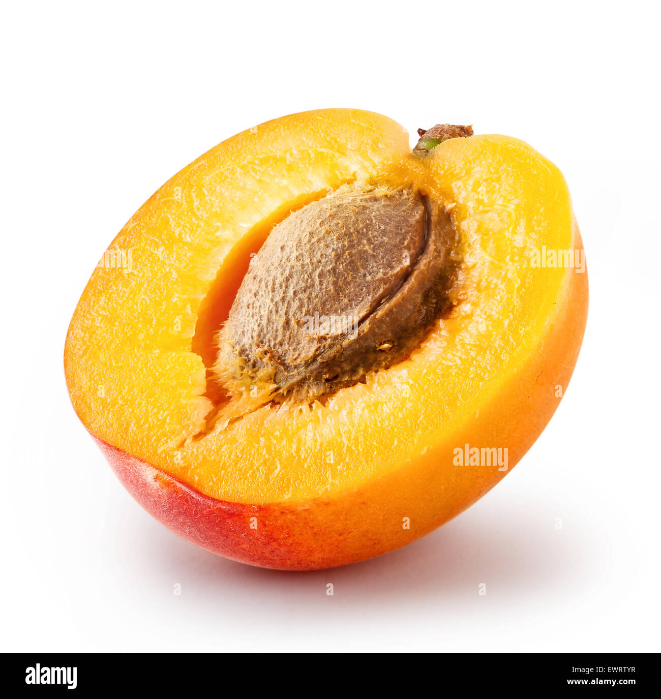 Cut apricot with a bone isolated on a white background Stock Photo - Alamy