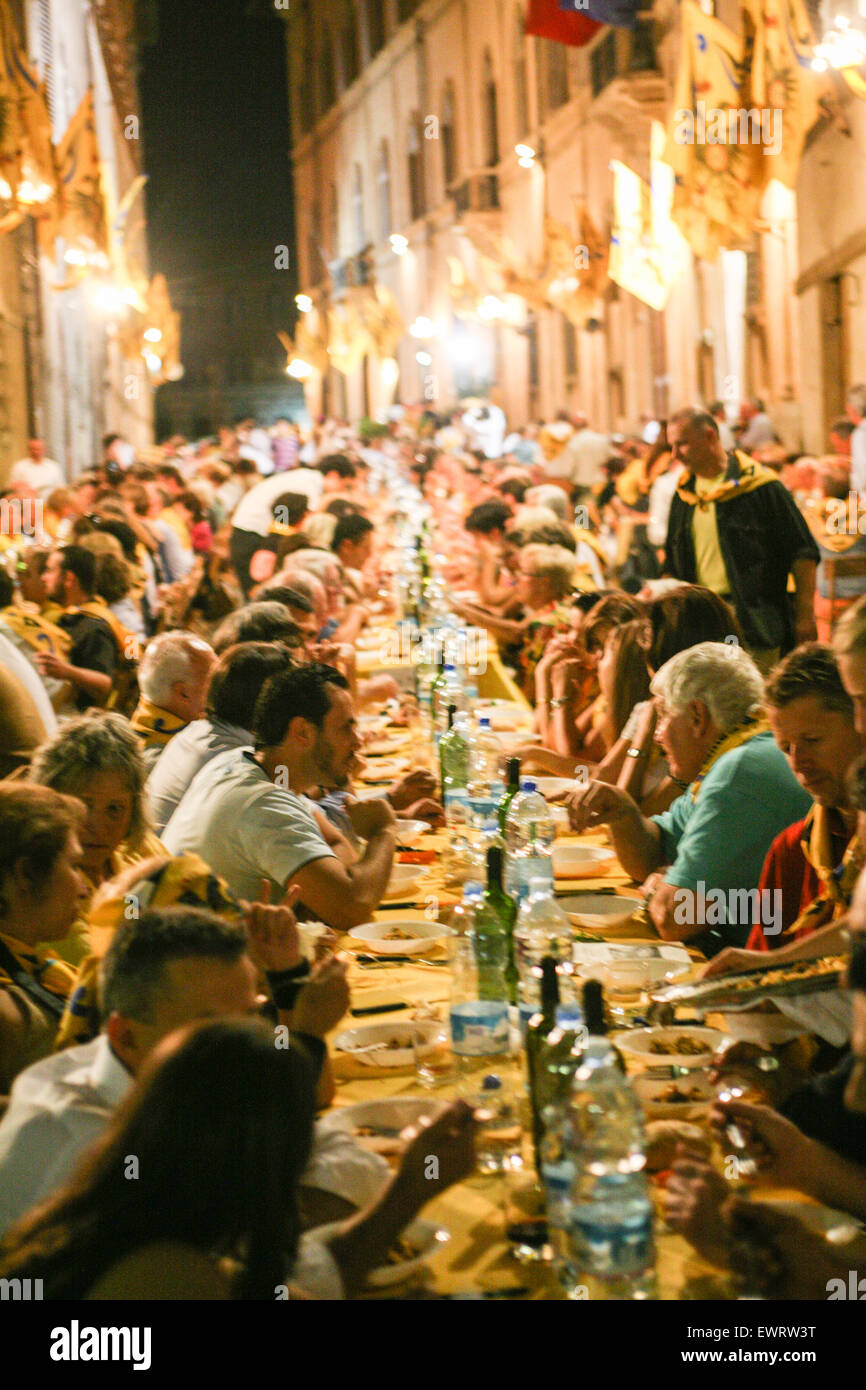 Eating dinner at a neighbourhood gathering. Siena is divided into 17 ...