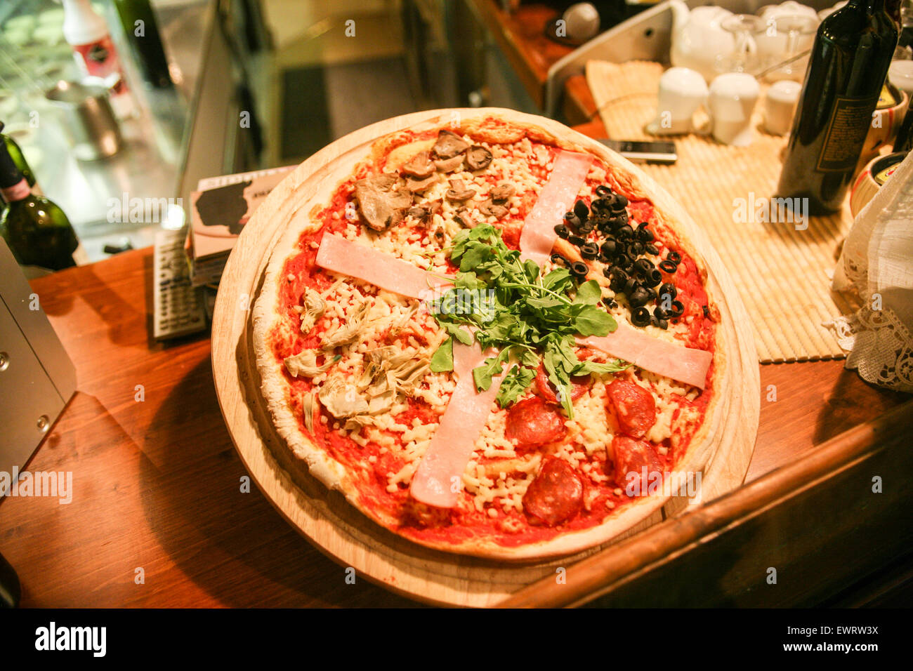 Pizza on display at the front of this restaurant displaying ...