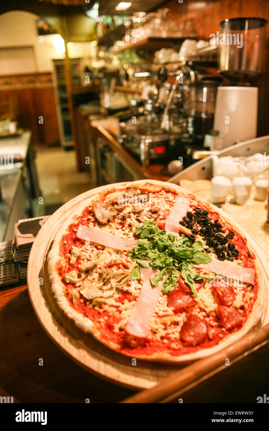 Pizza on display at the front of this restaurant displaying ...