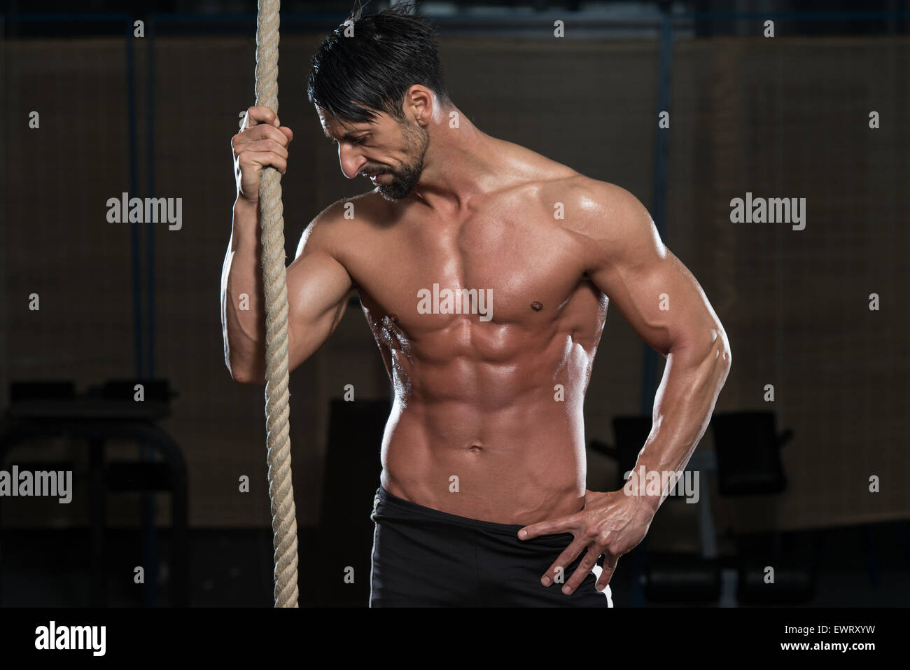 Man Resting After Fitness Rope Climb Exercise In Fitness Gym Workout ...