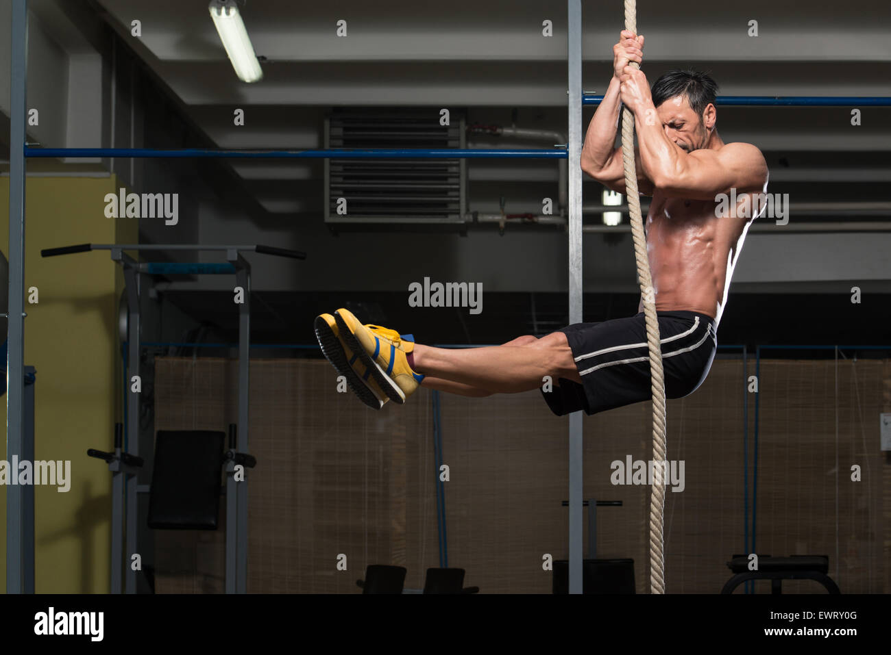 Fitness Rope Climb Exercise In Fitness Gym Workout Stock Photo - Alamy