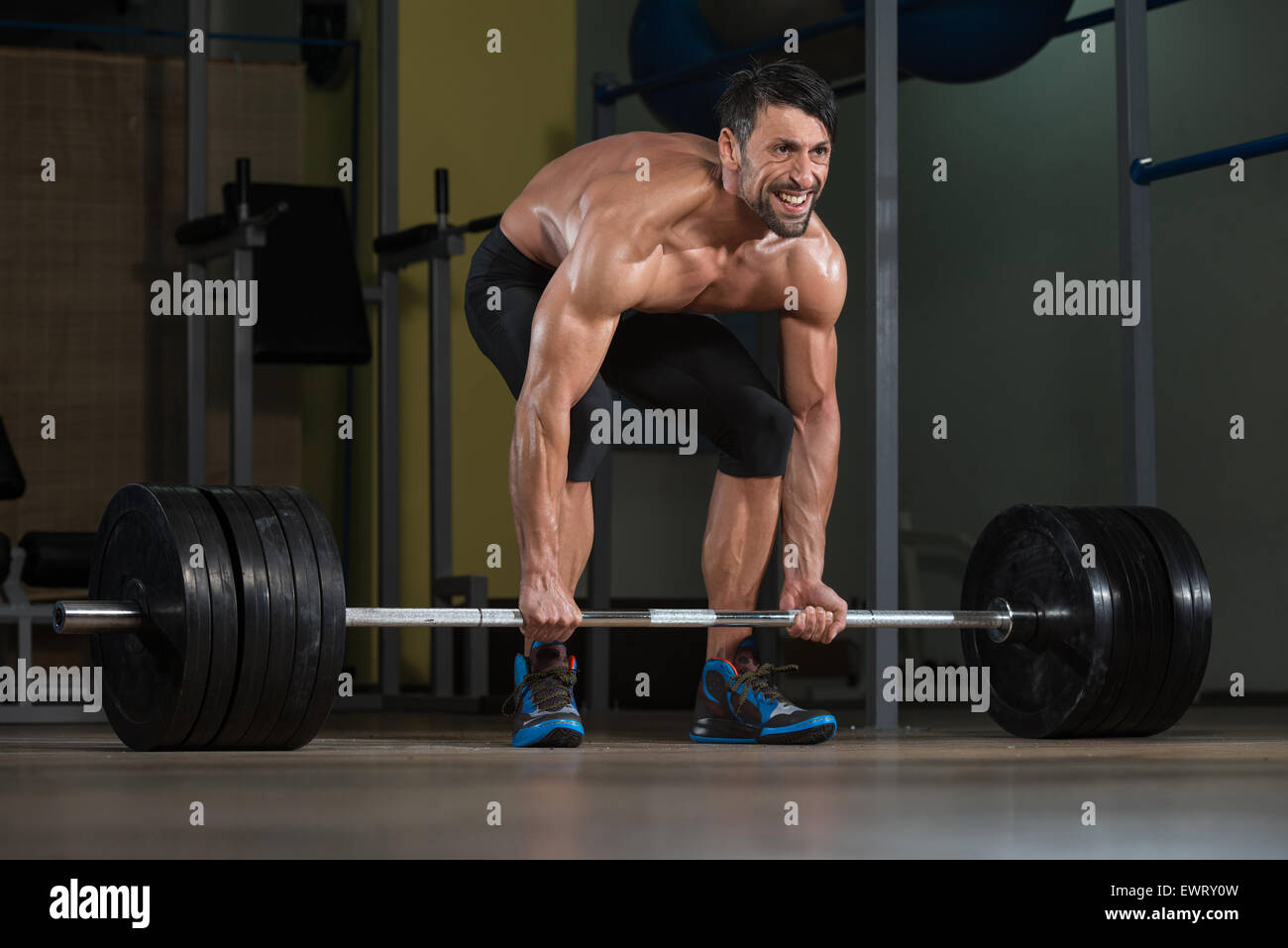 Male Fitness Athlete Lifting Deadlift In The Gym Stock Photo - Alamy