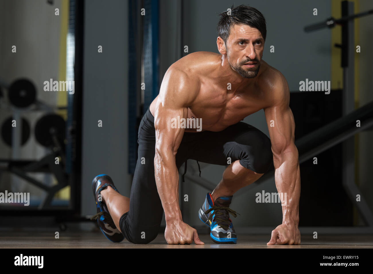 Strong muscular men kneeling on hi-res stock photography and images - Alamy