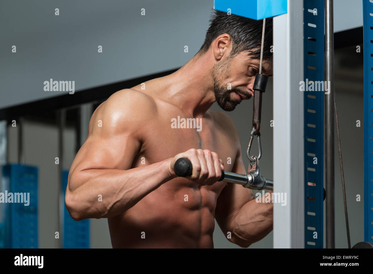 Strong young guy doing triceps hi-res stock photography and images - Alamy