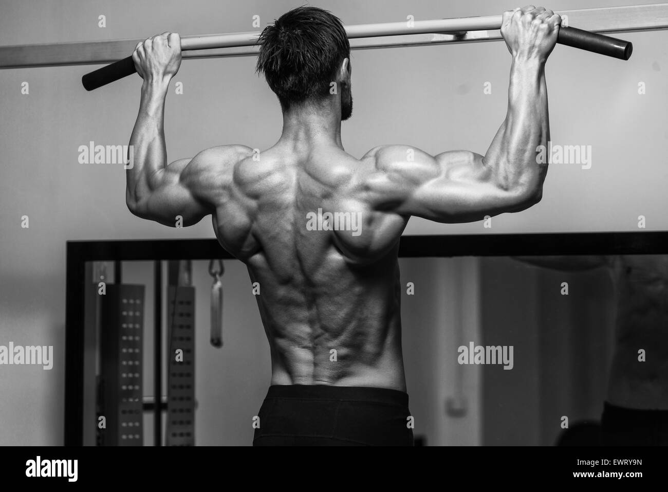 Male bodybuilder doing exercises muscles Black and White Stock Photos ...