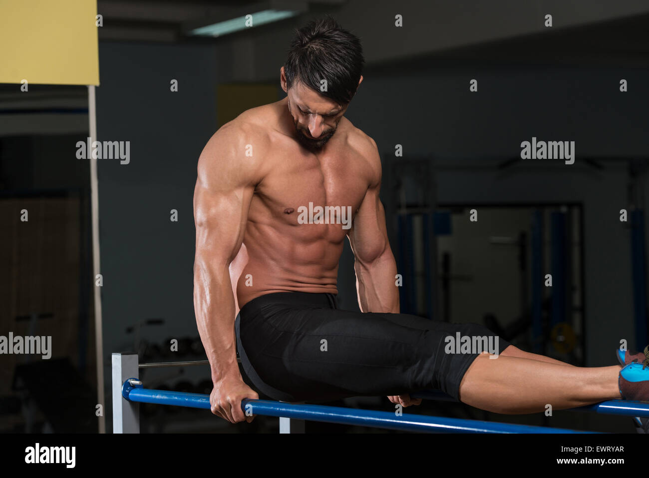Fit Athlete Working Out Exercise On Parallel Bars Stock Photo - Alamy