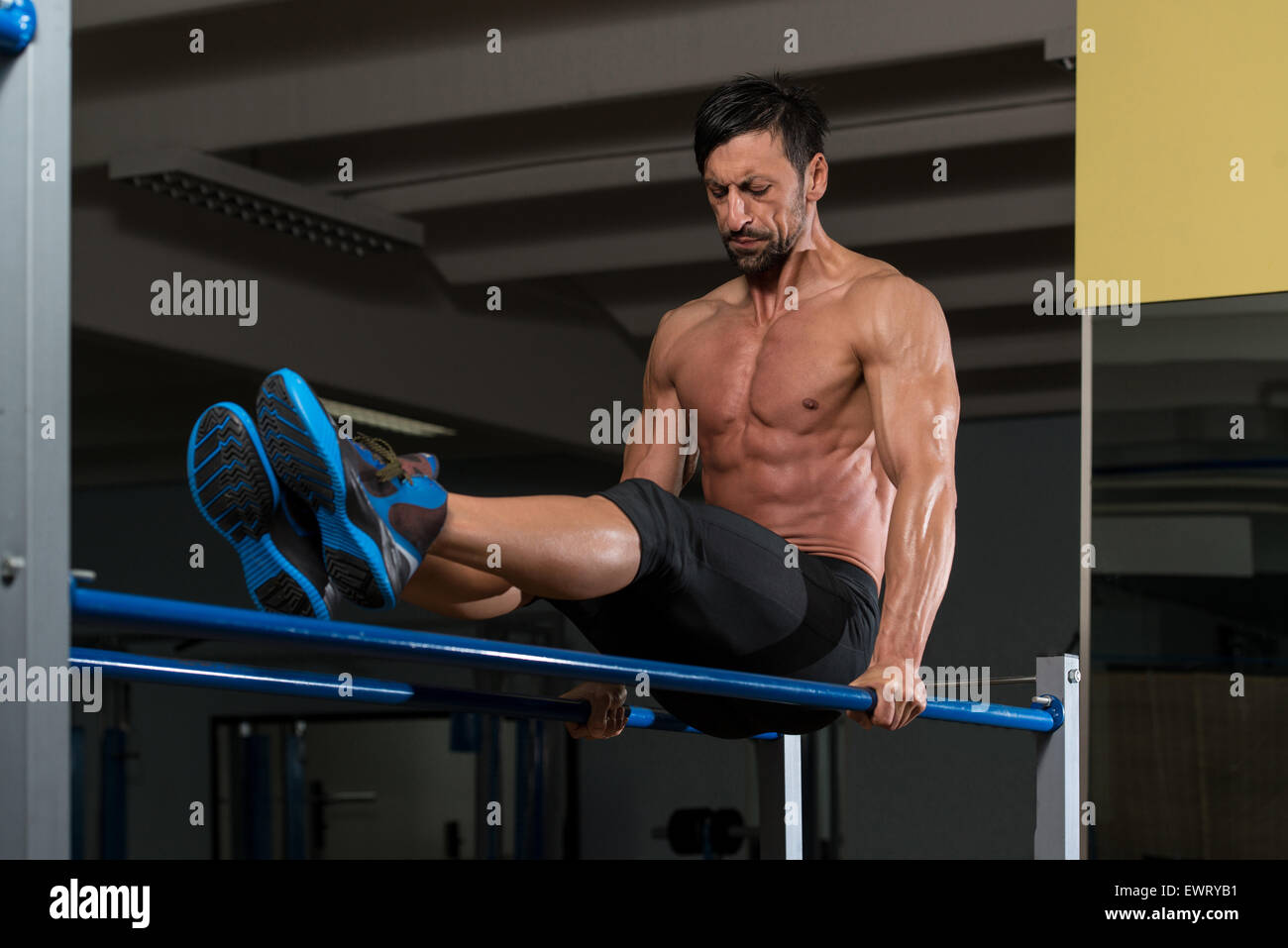Fit Athlete Working Out Exercise On Parallel Bars Stock Photo - Alamy