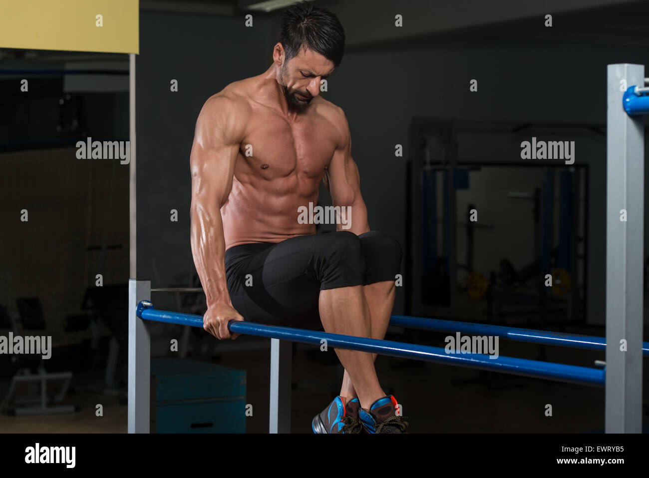 Fit Athlete Working Out Exercise On Parallel Bars Stock Photo - Alamy