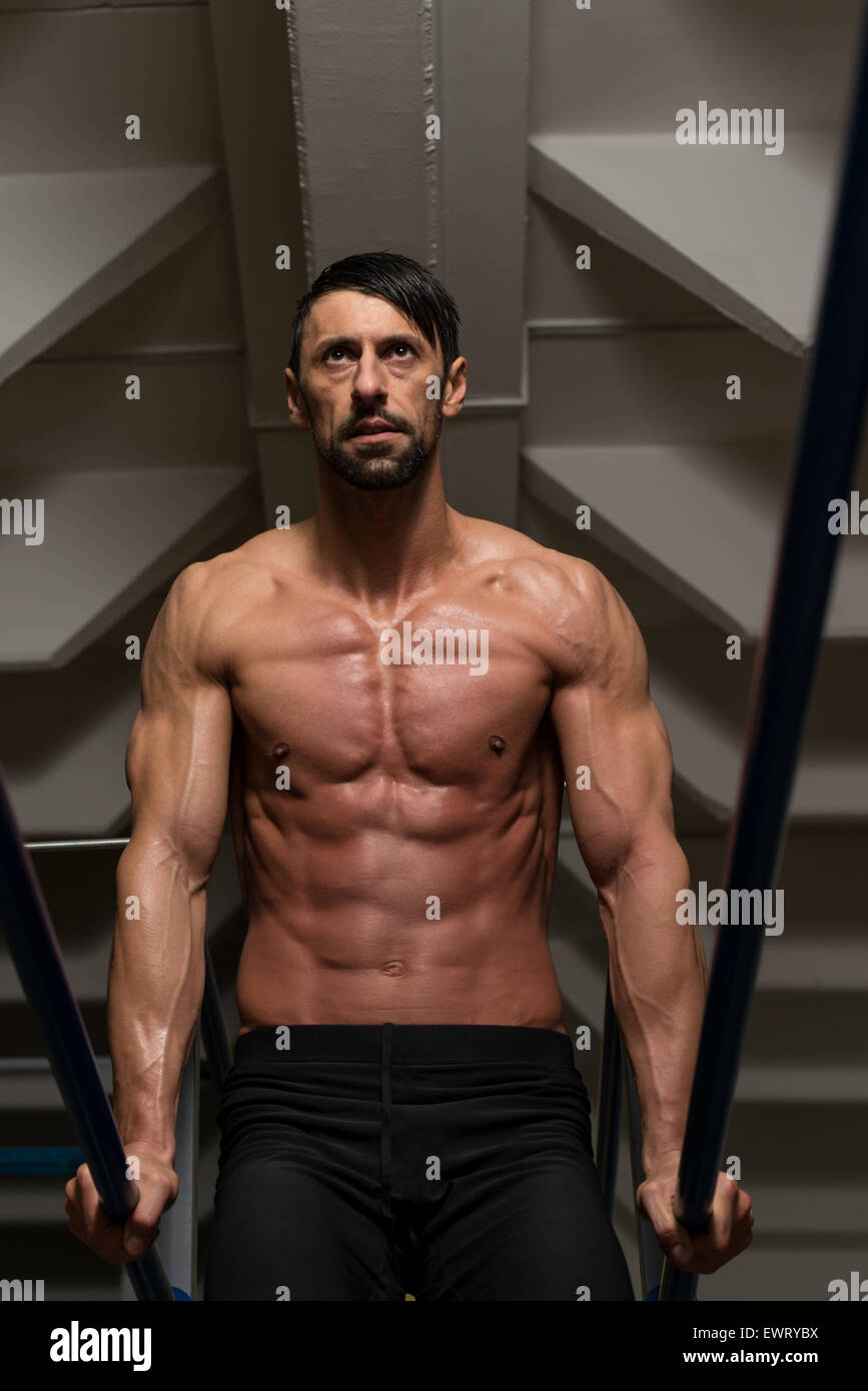 Fit Athlete Working Out Exercise On Parallel Bars Stock Photo - Alamy