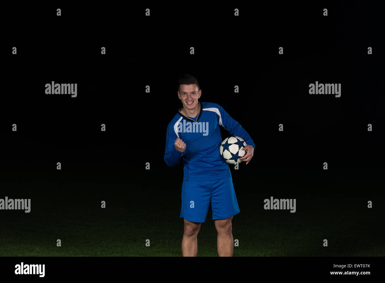 Man Soccer Player Celebrating Victory In Blue Uniform On Black ...