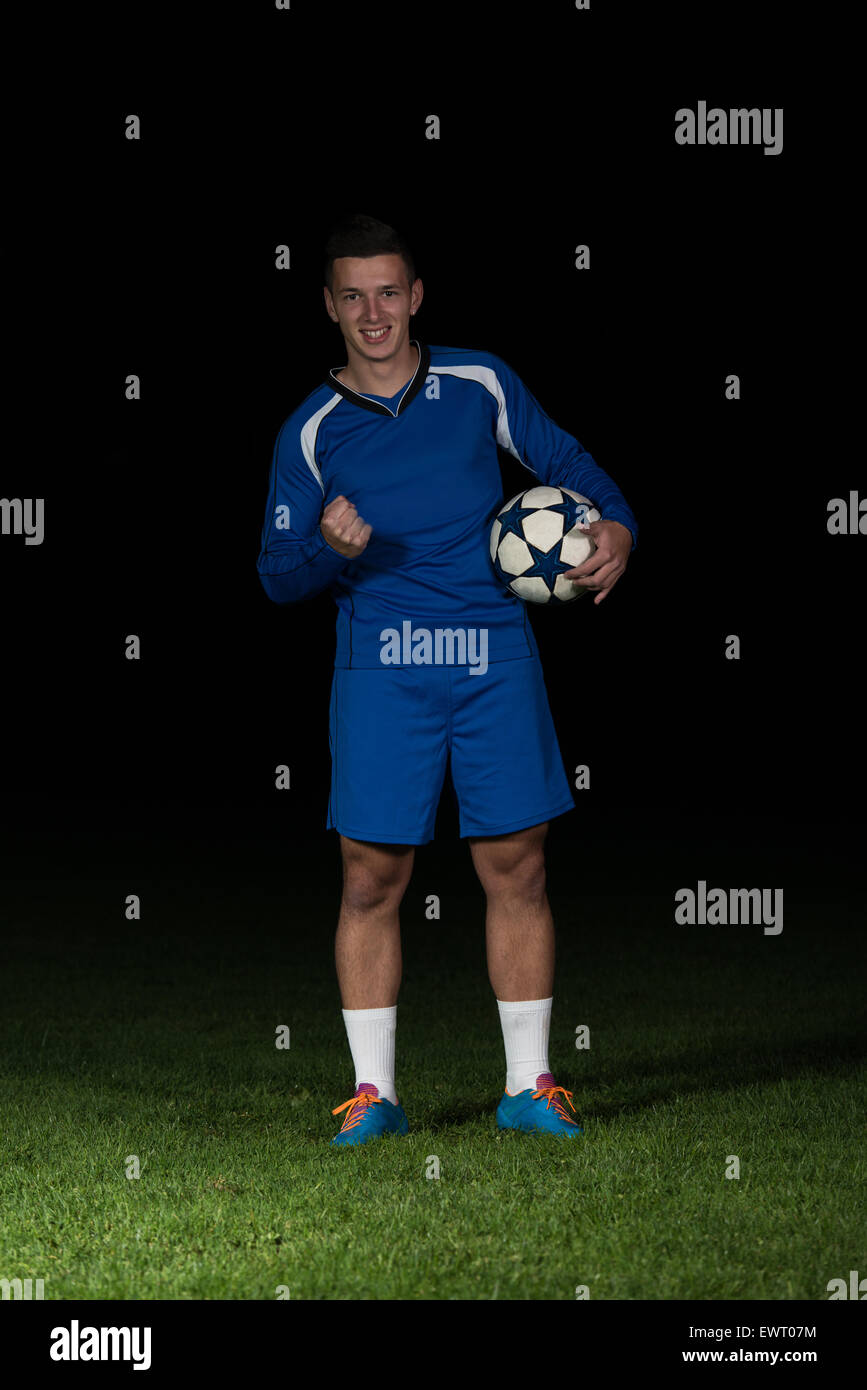 Man Soccer Player Celebrating Victory In Blue Uniform On Black ...