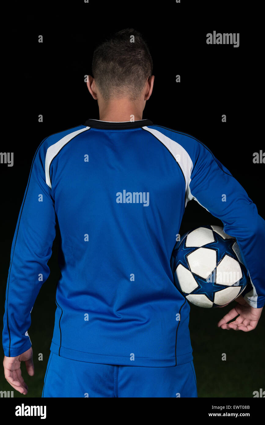 Back View Of Soccer Player In Blue Uniform Isolated On Black Background ...