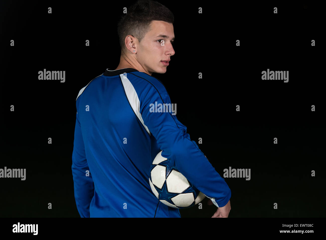 Back View Of Soccer Player In Blue Uniform Isolated On Black Background ...