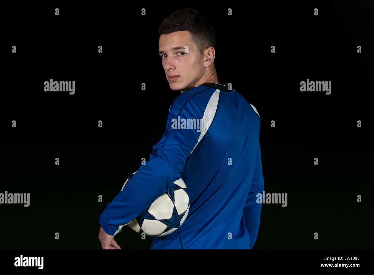 Back View Of Soccer Player In Blue Uniform Isolated On Black Background ...