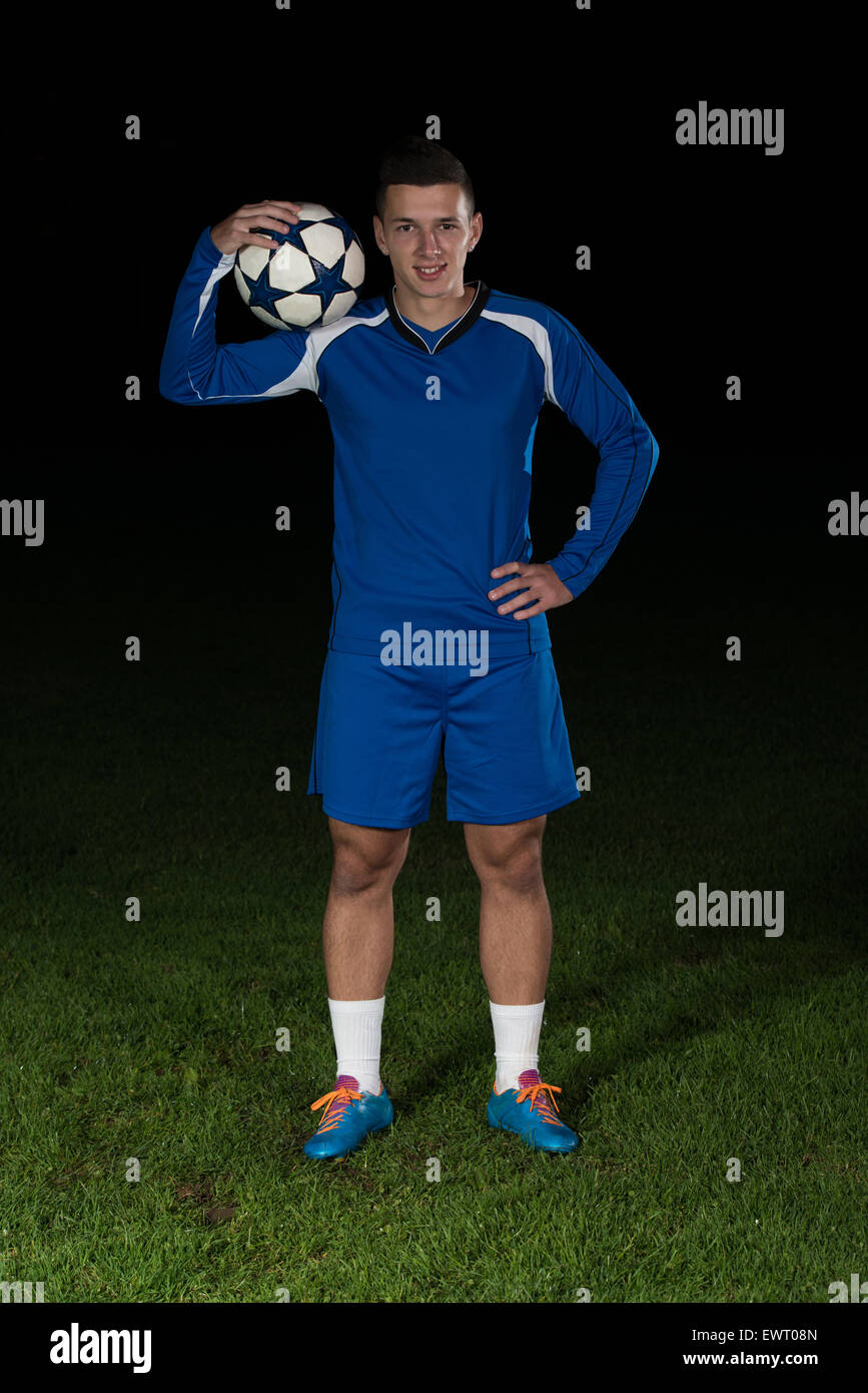 Soccer Player And Ball On Football Stadium Field Isolated On Black ...