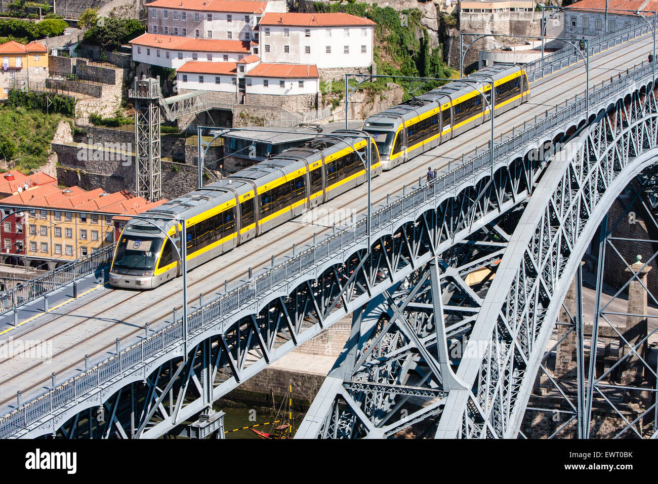 Metro rail train on top of Dom Luis I Bridge, which is also a walkway ...