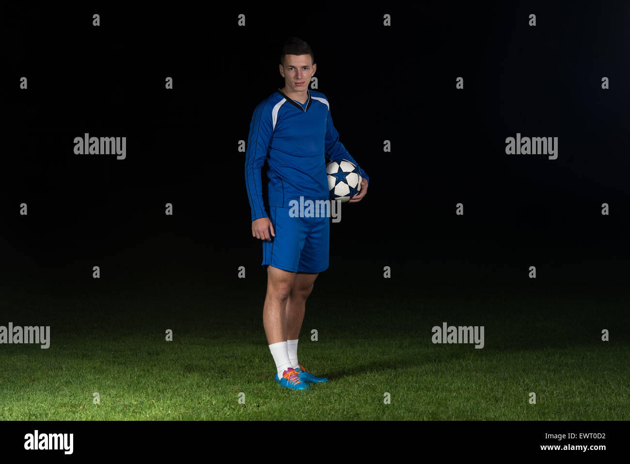 Portrait Of A Soccer Player And Ball On Football Stadium Field Isolated ...