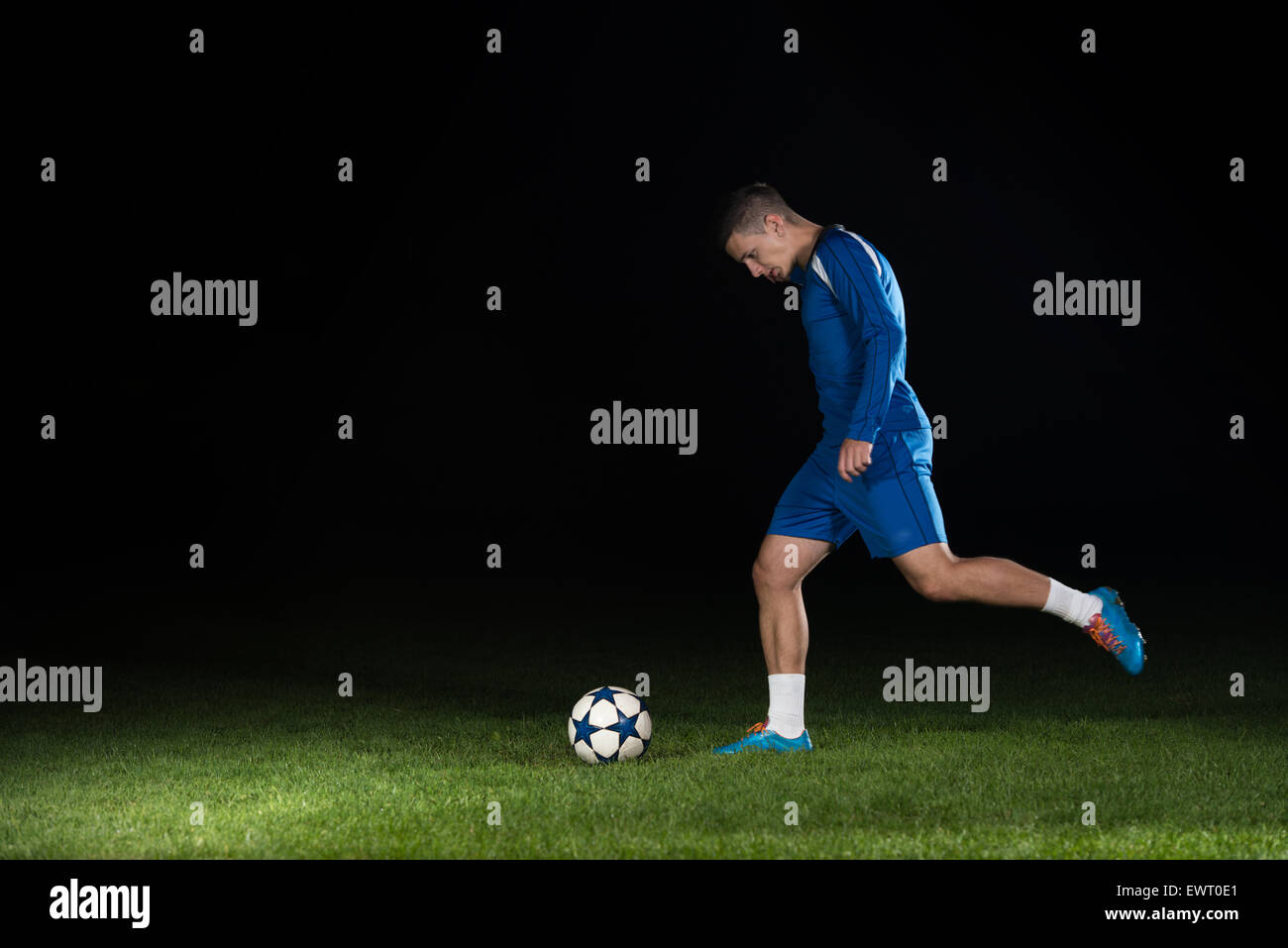 Soccer Player Doing Kick With Ball On Football Stadium Field Isolated ...