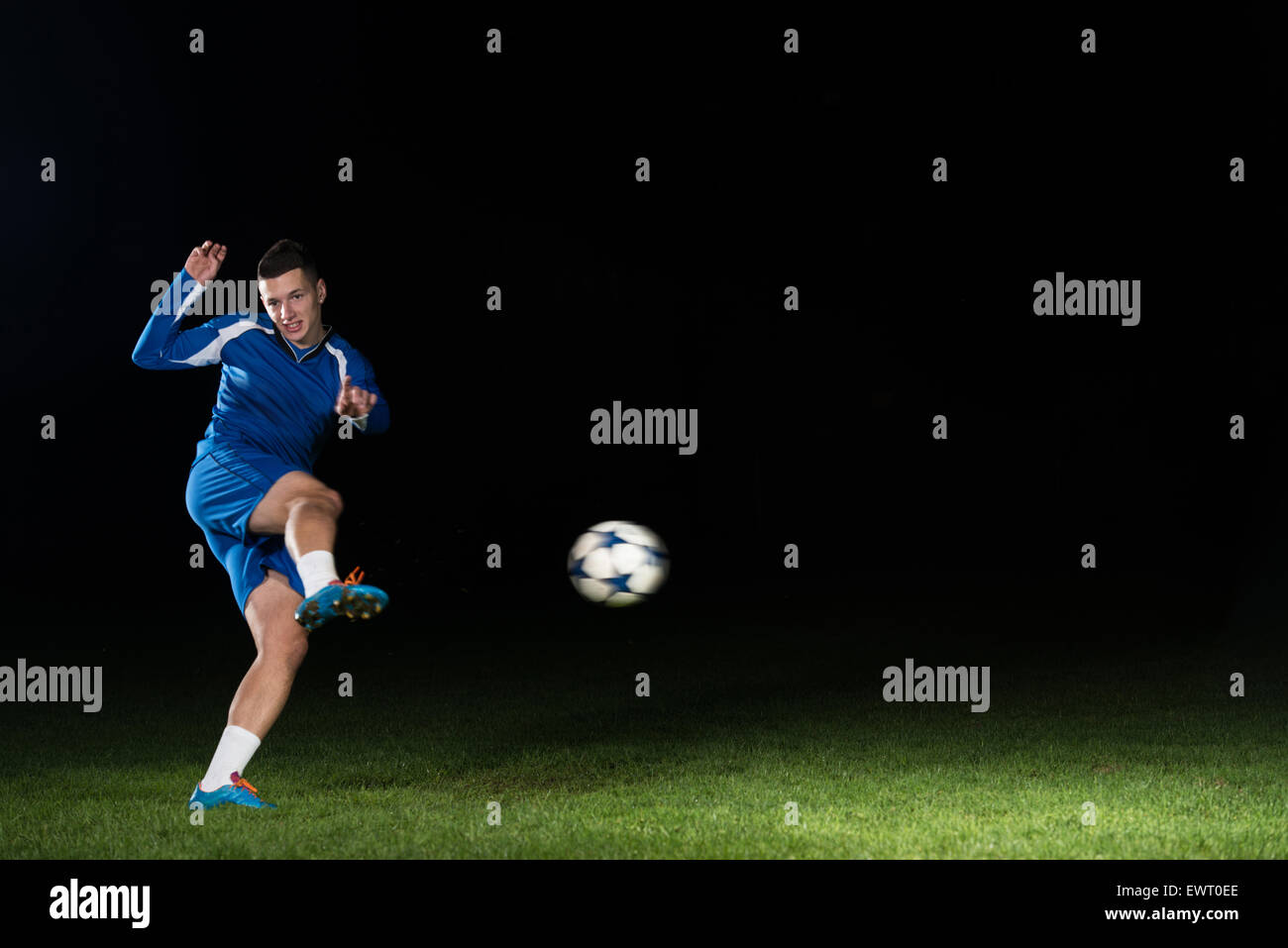 Soccer Player Doing Kick With Ball On Football Stadium Field Isolated ...