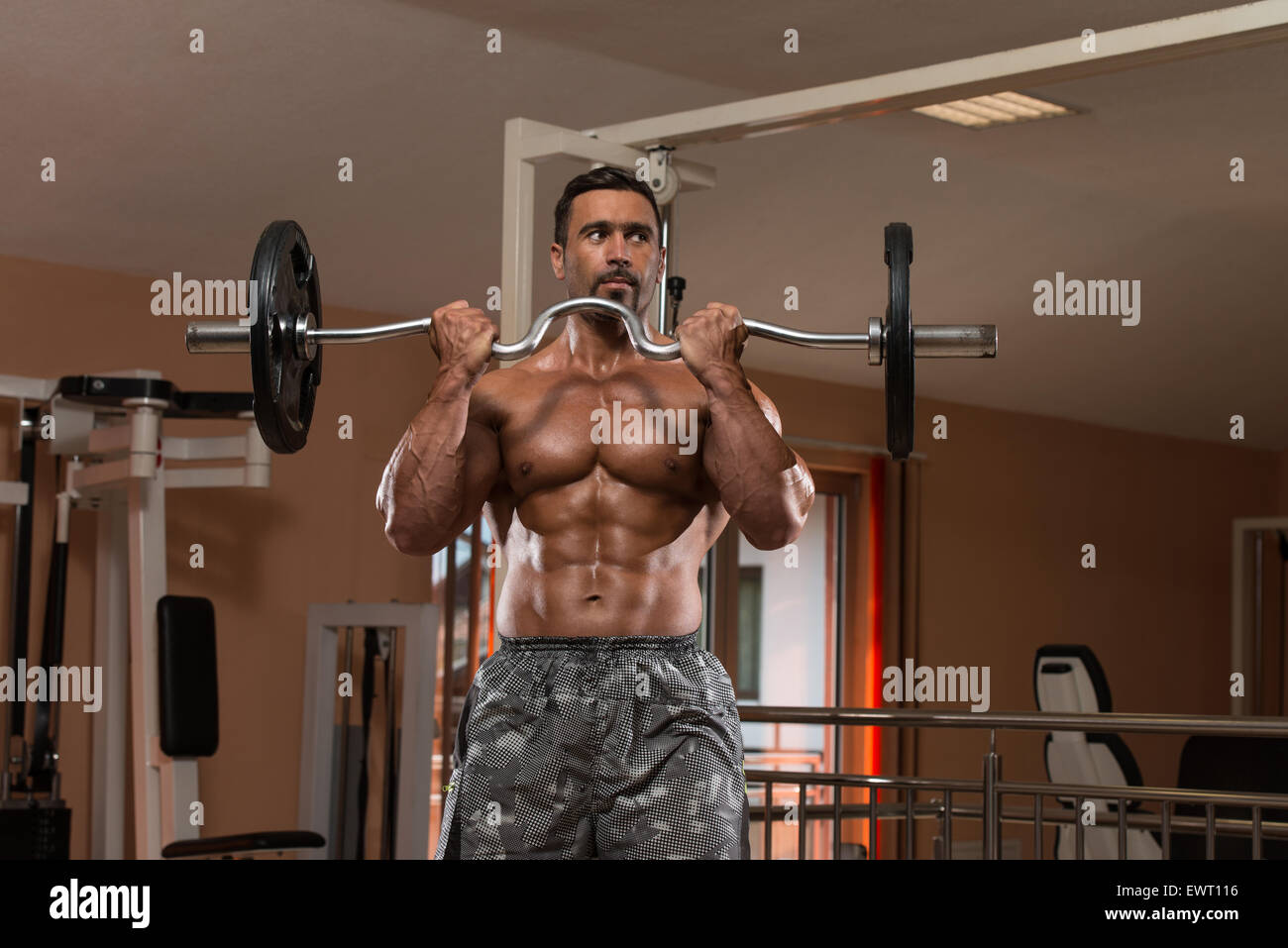 Mexican Bodybuilder Doing Heavy Weight Exercise For Biceps Stock Photo ...