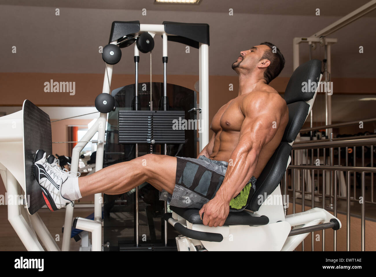 Bodybuilder Doing Heavy Weight Exercise For Legs Stock Photo - Alamy