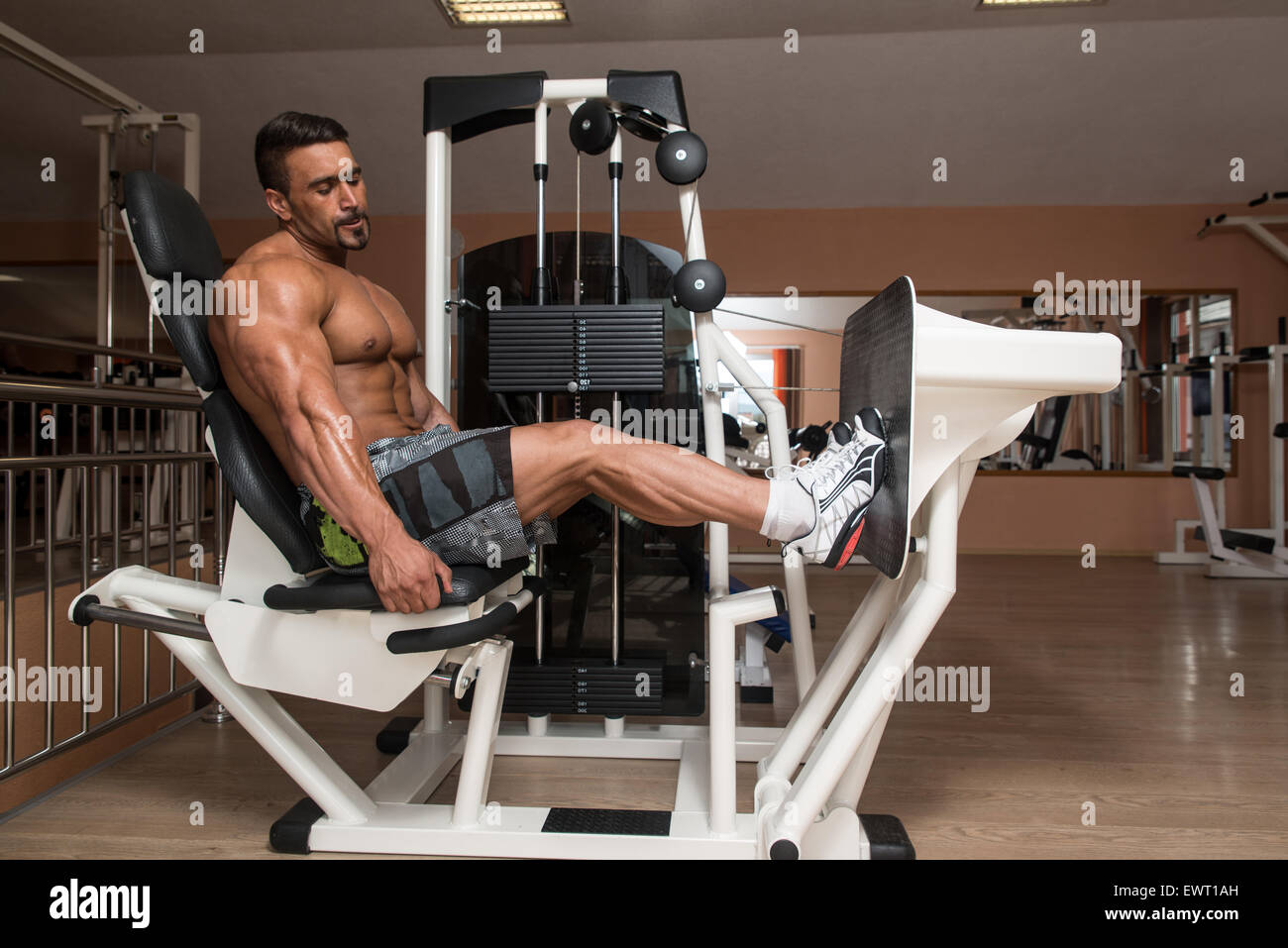 Bodybuilder Doing Heavy Weight Exercise For Legs Stock Photo - Alamy