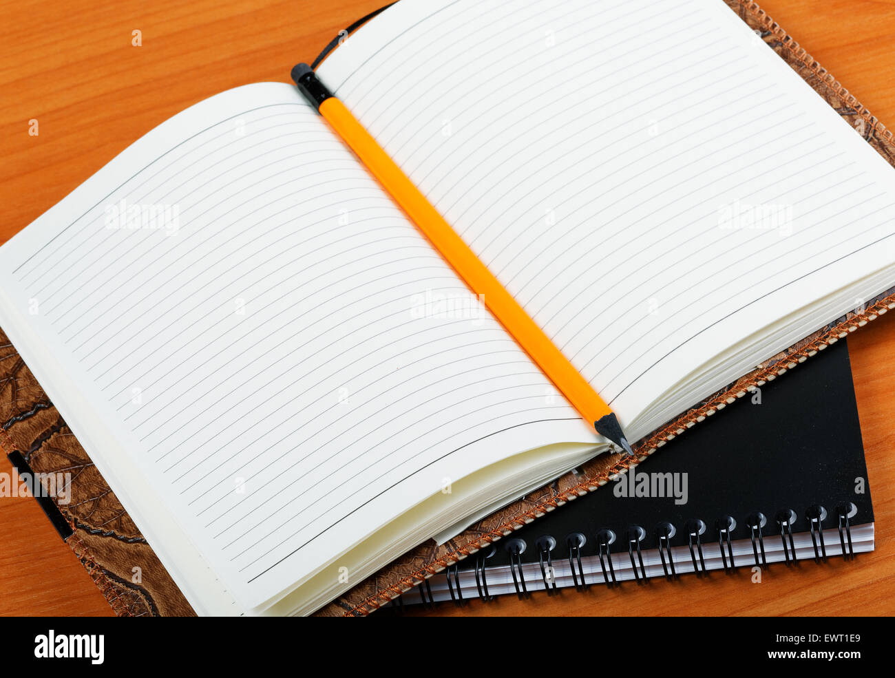 Pile of notebooks pencil hi-res stock photography and images - Alamy