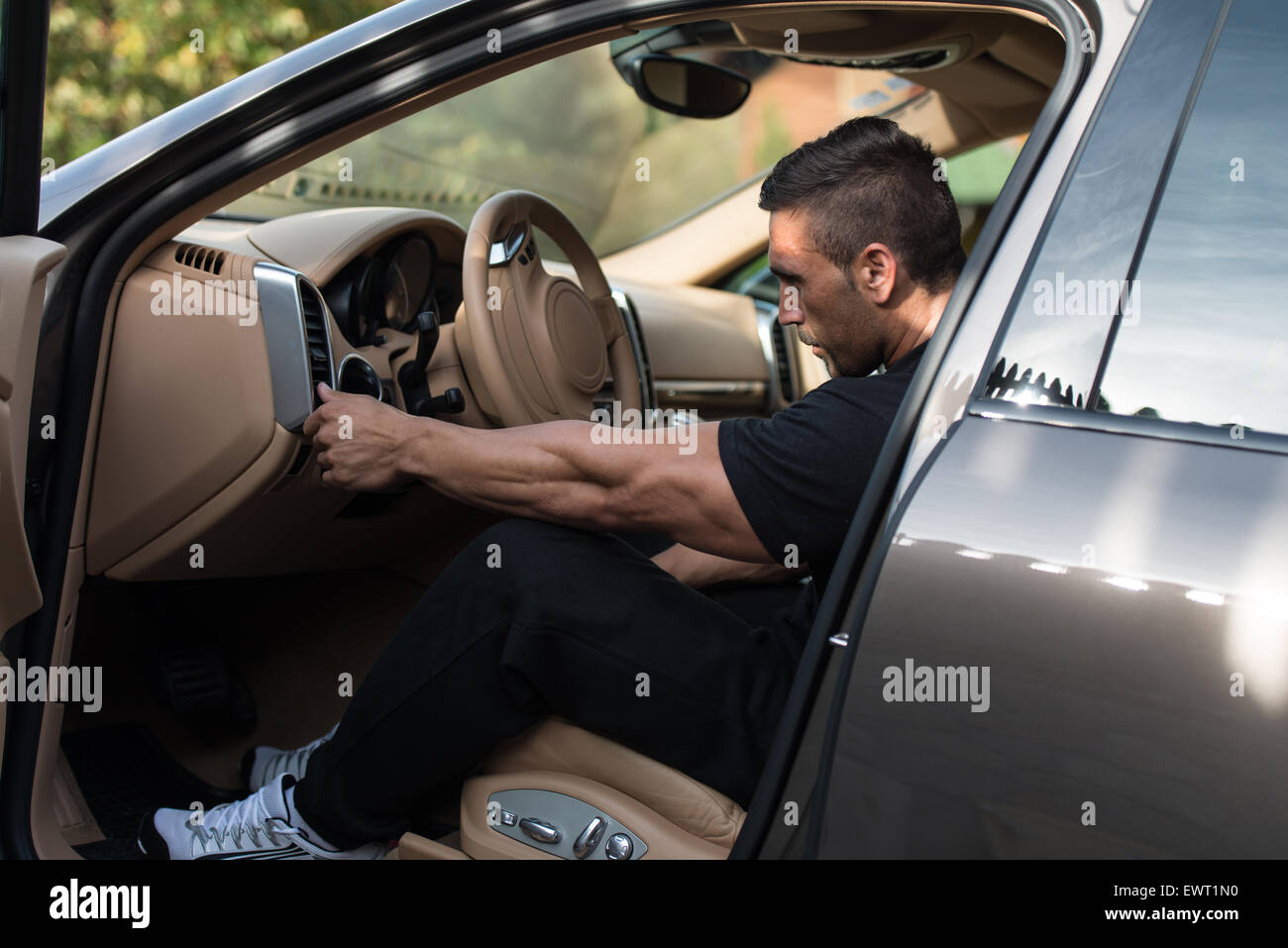 Handsome indian man driving car hi-res stock photography and images - Alamy