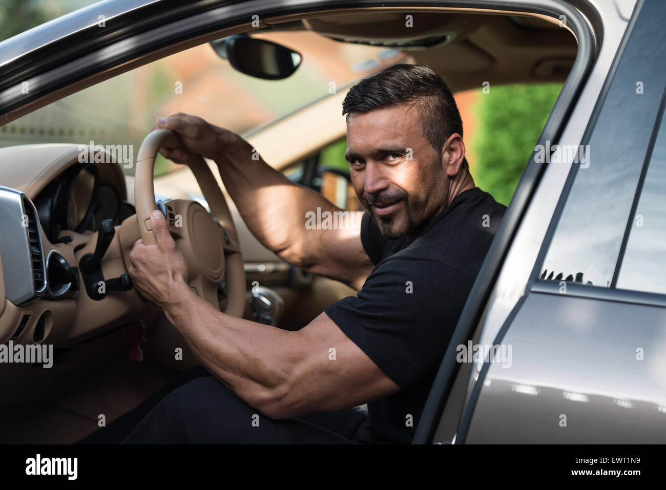 Handsome indian man driving car hi-res stock photography and images - Alamy