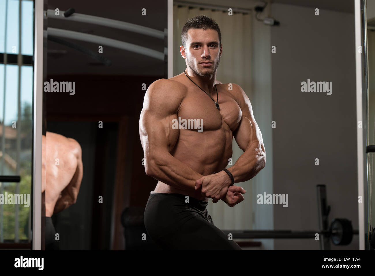 Man flexing muscles hi-res stock photography and images - Alamy