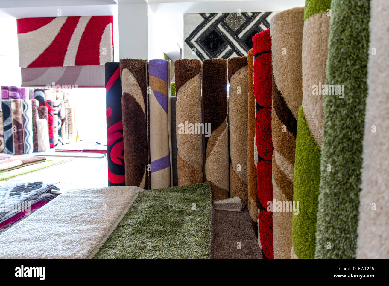 Colorful Collection Of Carpets And Rugs Folded And Displayed. Textured ...