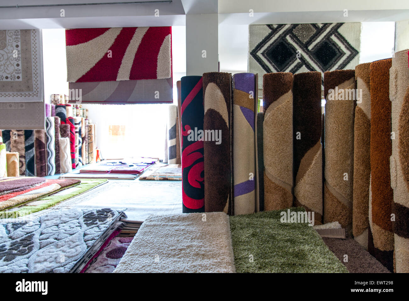 Colorful Collection Of Carpets And Rugs Folded And Displayed. Textured ...