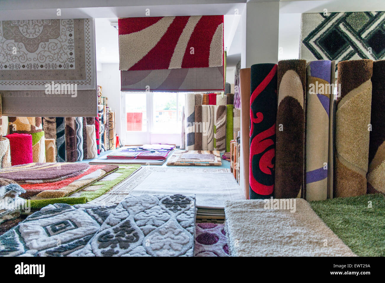 Colorful Collection Of Carpets And Rugs Folded And Displayed. Textured ...