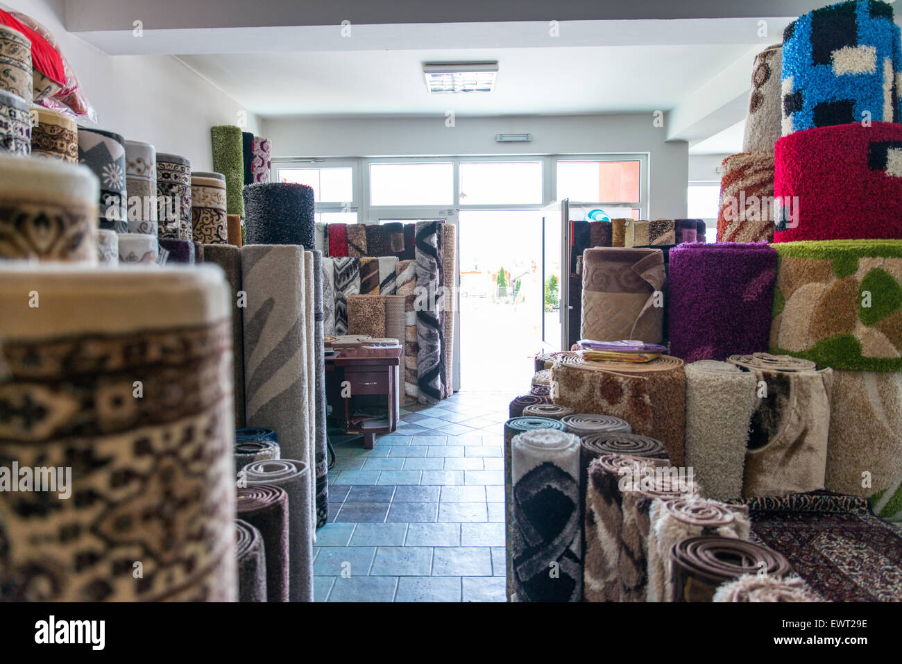 Colorful Collection Of Carpets And Rugs Folded And Displayed. Textured ...