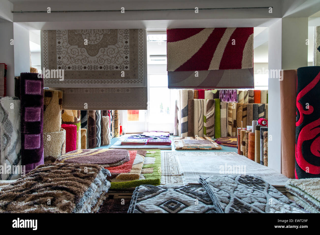 Colorful Collection Of Carpets And Rugs Folded And Displayed. Textured ...