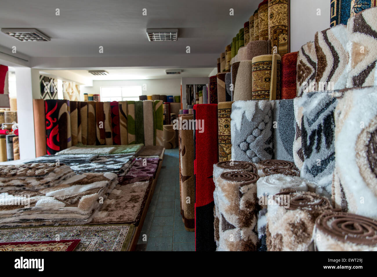 Colorful Collection Of Carpets And Rugs Folded And Displayed. Textured ...